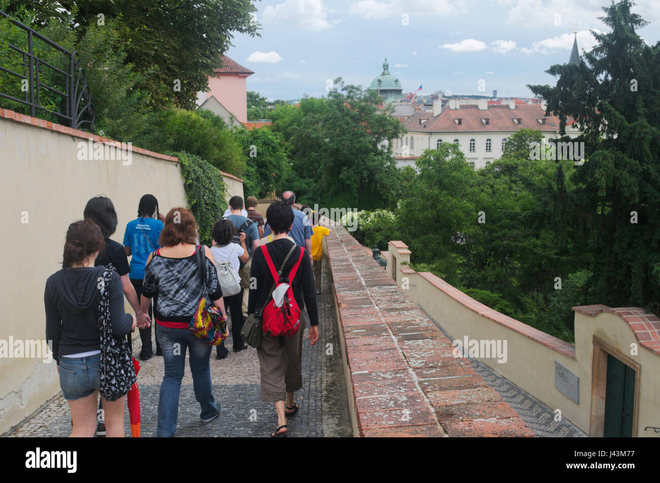 Group of tourists on the old castle steps from Prague castle down to ...