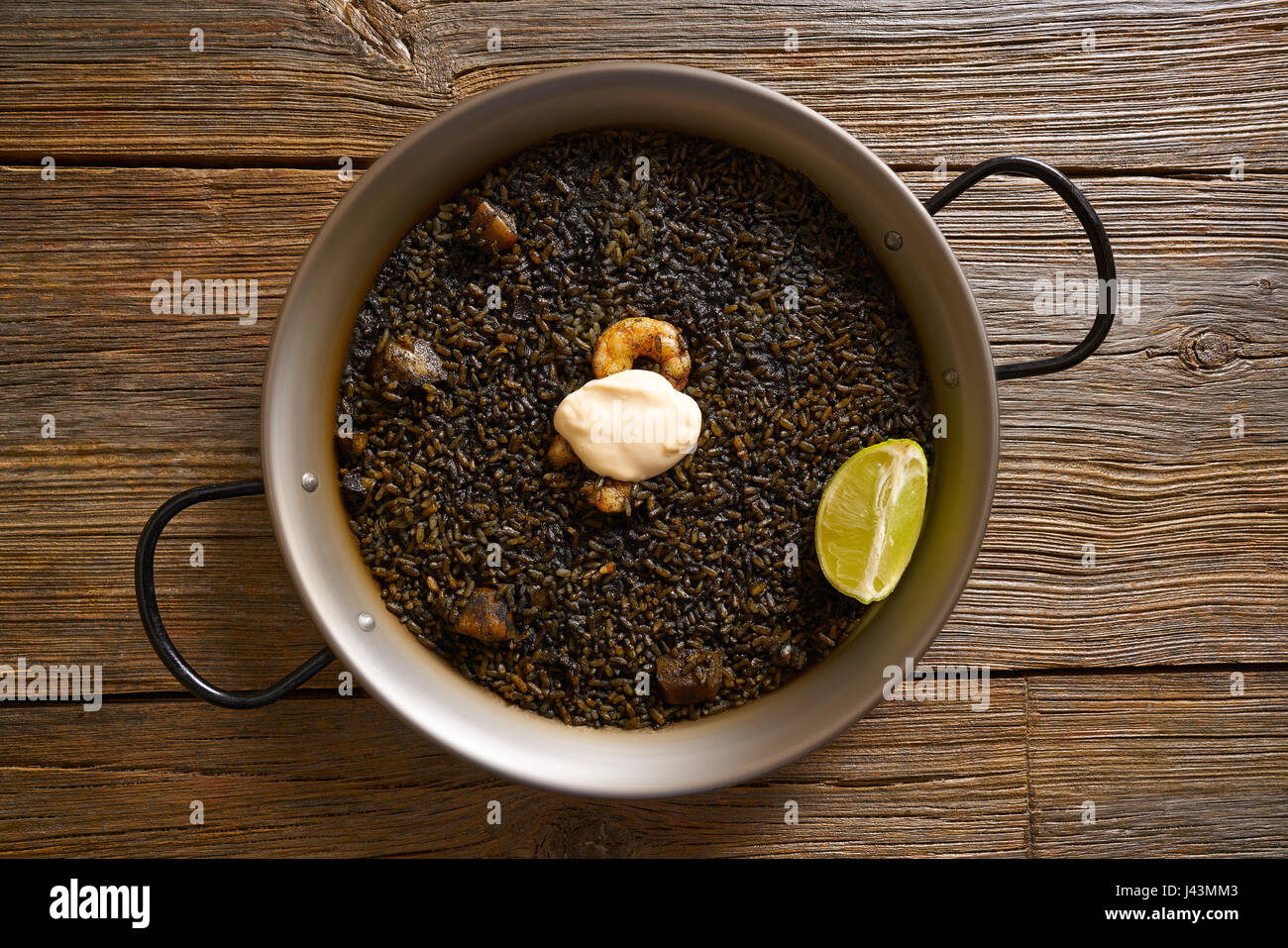 Black rice Paella recipe for two from Valencia Spain Stock Photo - Alamy