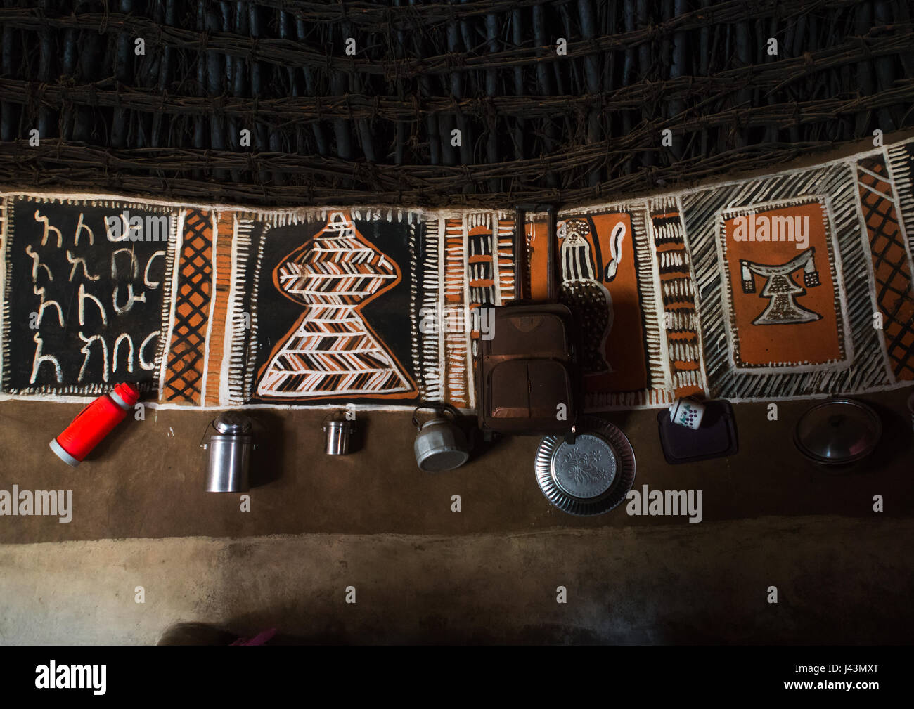 Inside a traditional house with decorated and painted walls, Kembata ...