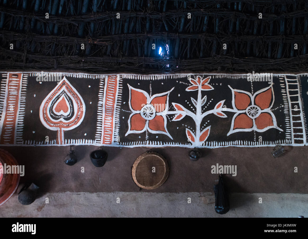 Inside a traditional house with decorated and painted walls, Kembata ...