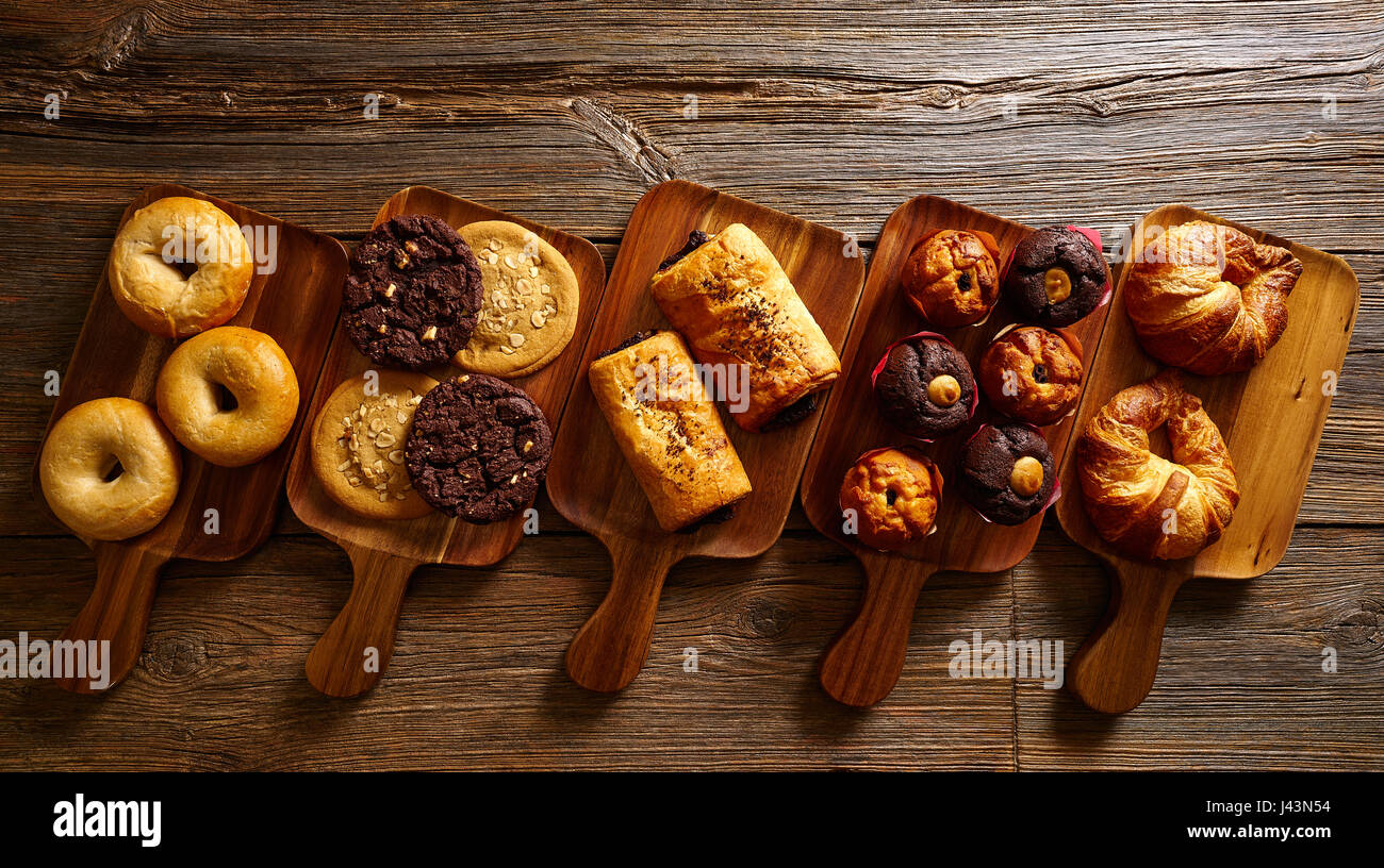 Pastries in a row Croissant Muffin Cookie Bagel and Neapolitan bakery ...