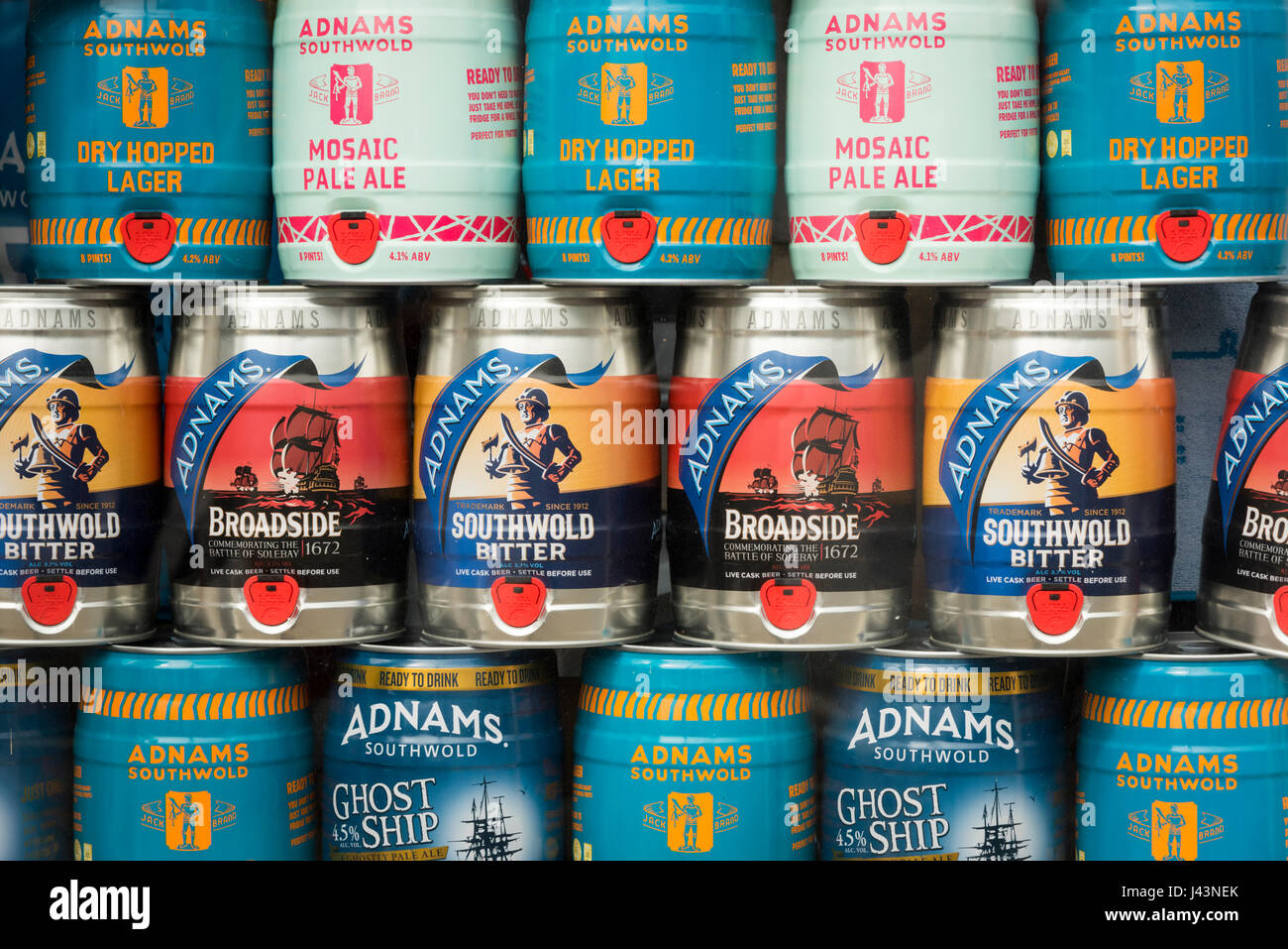 Metal barrels of beer brewed by the Adnams Brewery Suffolk piled up in ...