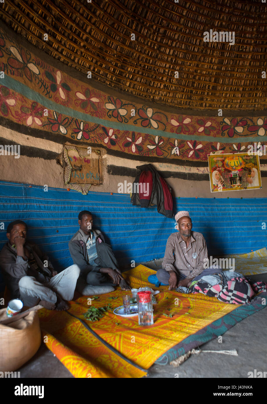 Men chewing khat inside their traditional house with decorated and ...
