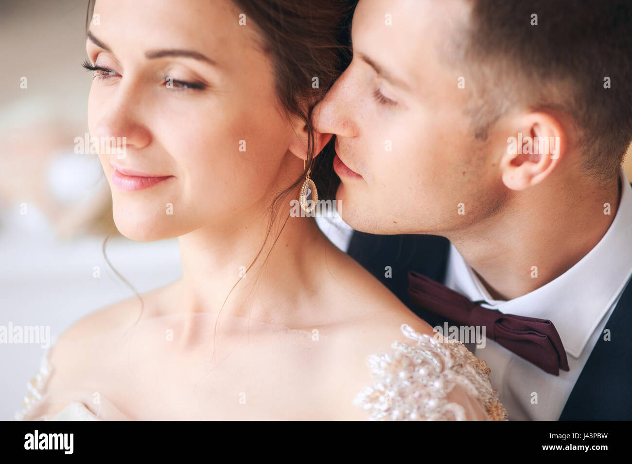 wedding couple on the studio. Wedding day. Happy young bride and groom ...