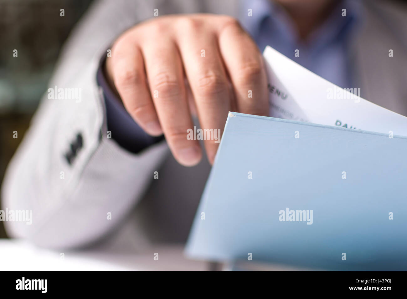 Male Hand Holding Restaurant Menu to Make Order for Lunch Stock Photo ...