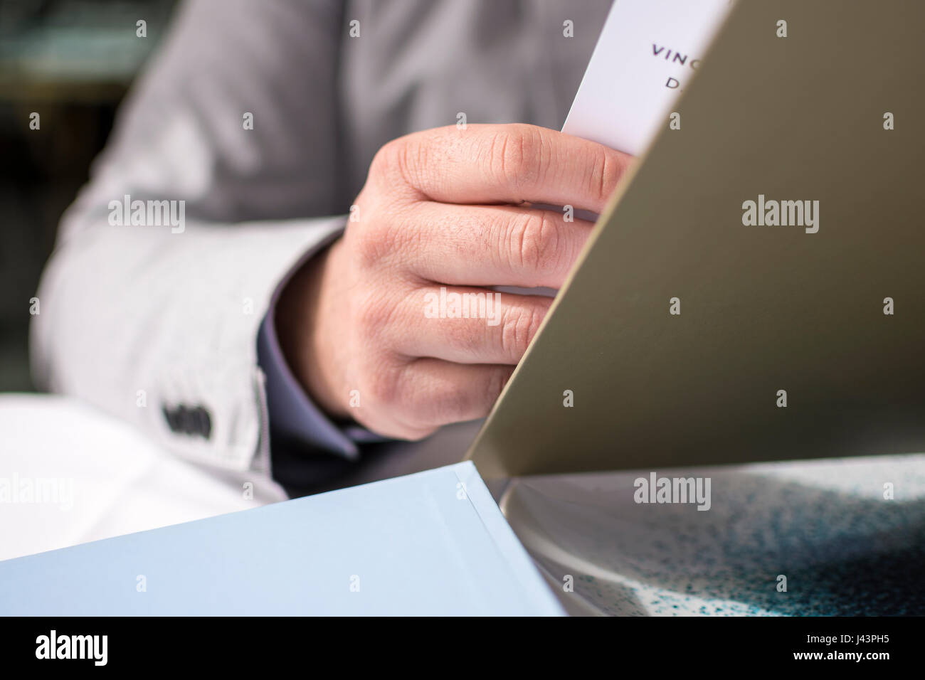 Male Hand Holding Restaurant Menu to Make Order for Lunch Stock Photo ...