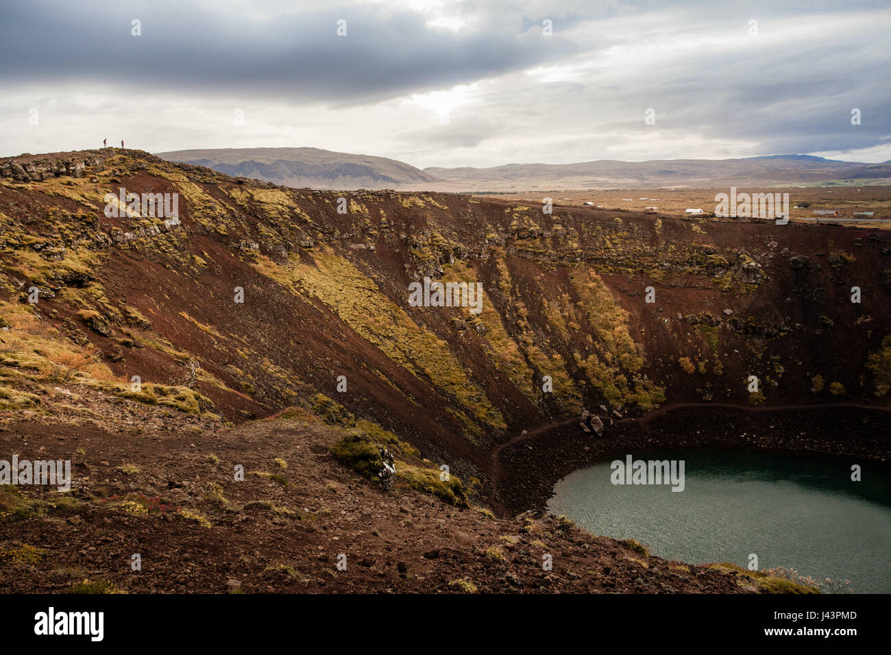 Crater of an volcano. With great mountain range in the background ...