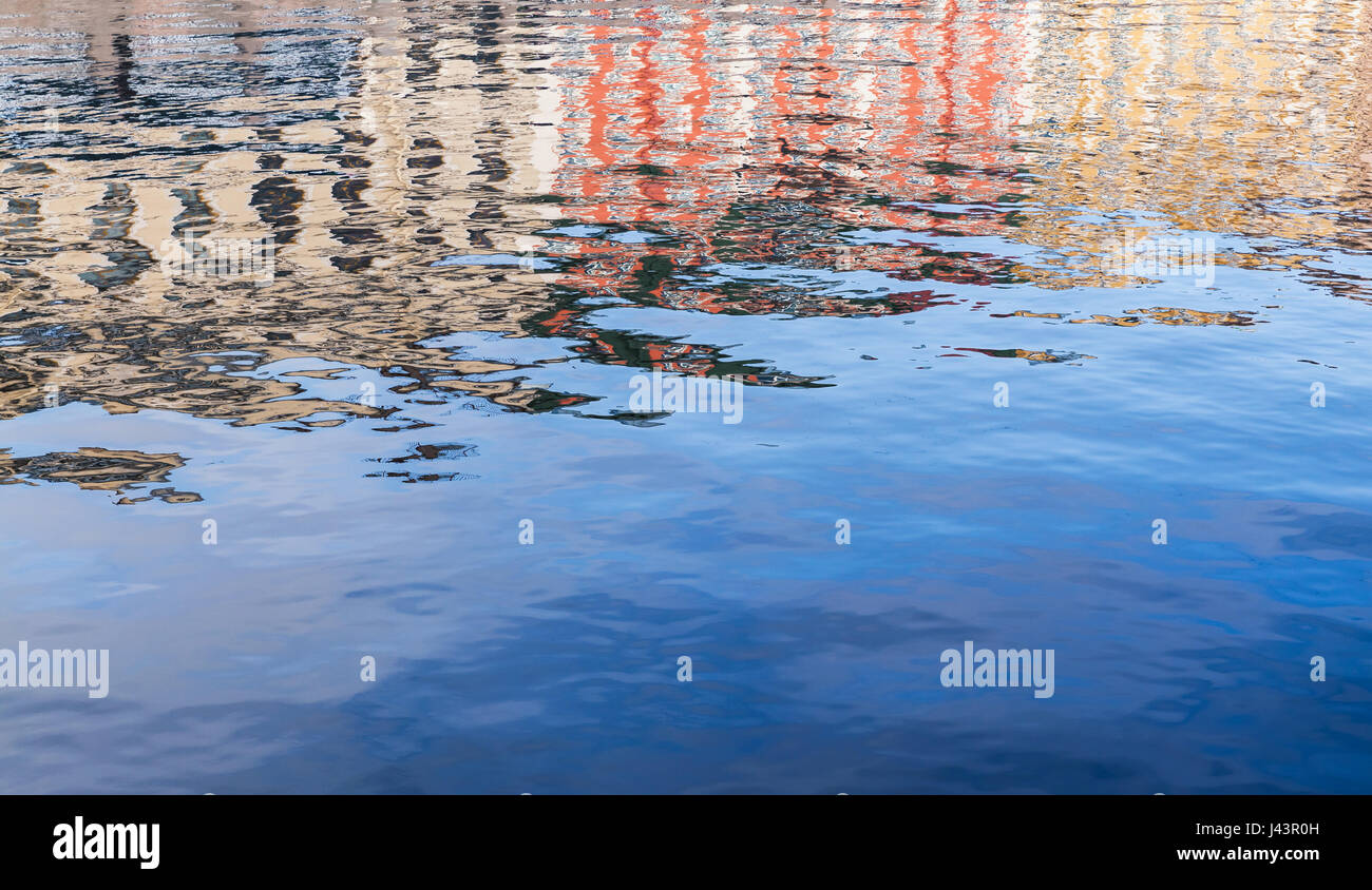 Fontanka river, ripple water surface with old buildings reflections ...