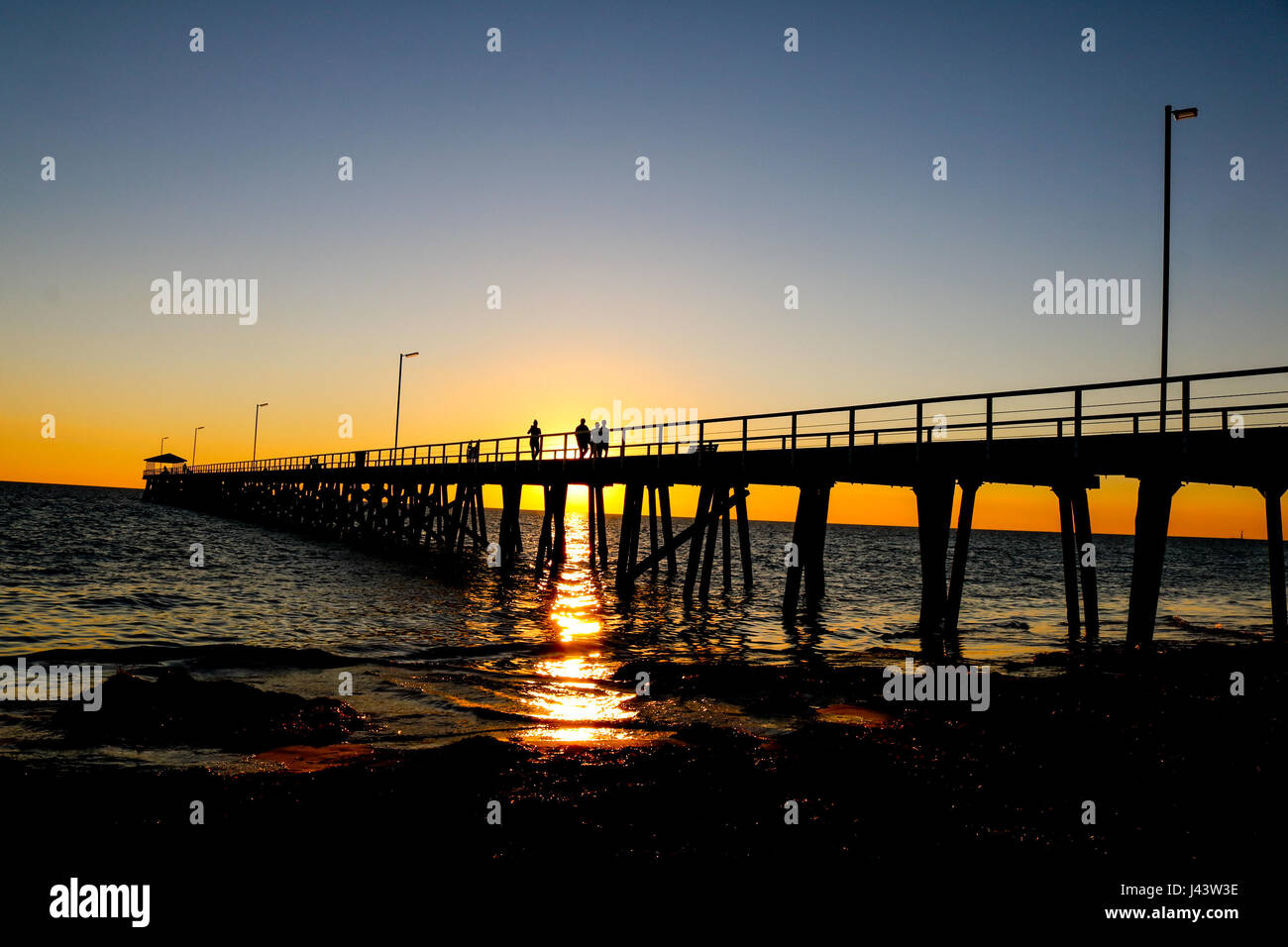 Adelaide Australia. 9th May 2017. Grange jetty is silhouetted against a ...
