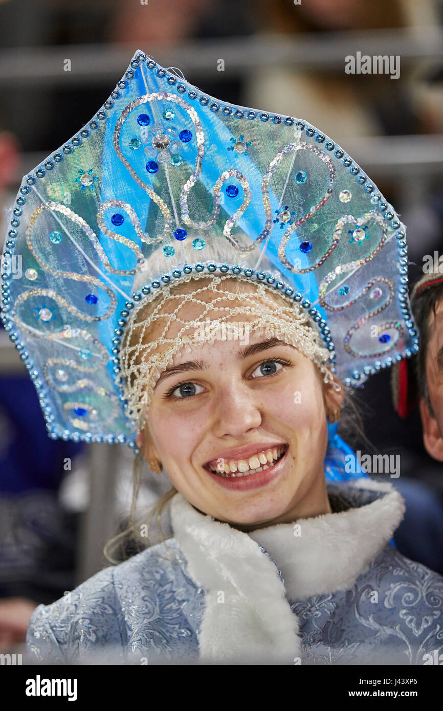 Russian woman in national costume, hockey fans, supporters, spectators ...