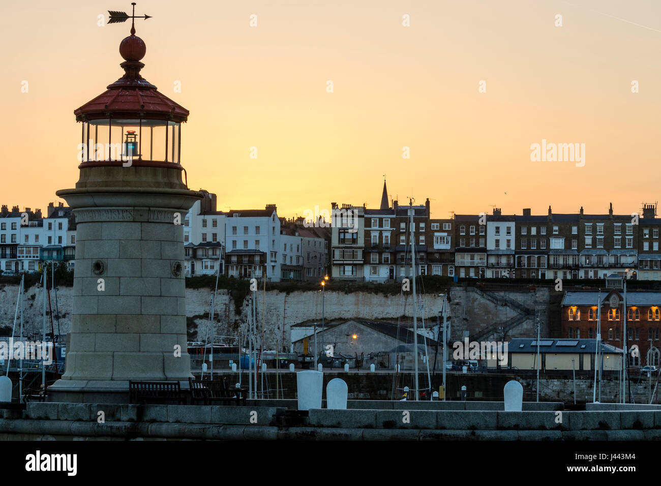 Ramsgate Royal harbour lighthouse with the town behind set against a ...