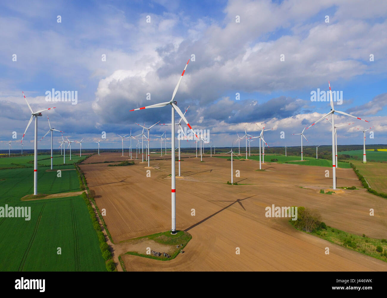 Clouds hang in the sky over a wind farm in Jacobsdorf in the state of ...