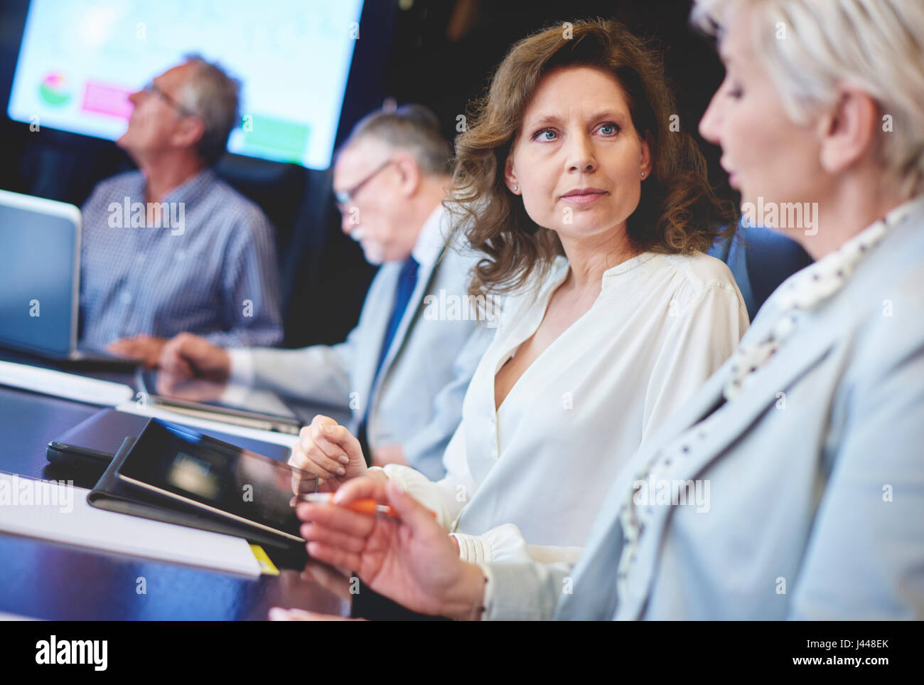 Woman explaining to colleague her idea Stock Photo - Alamy