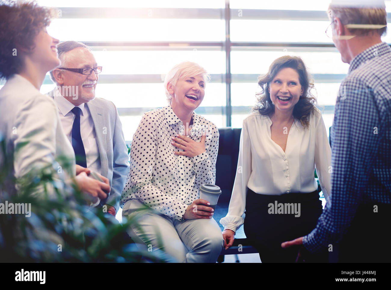 Business people having conversation at break time Stock Photo - Alamy
