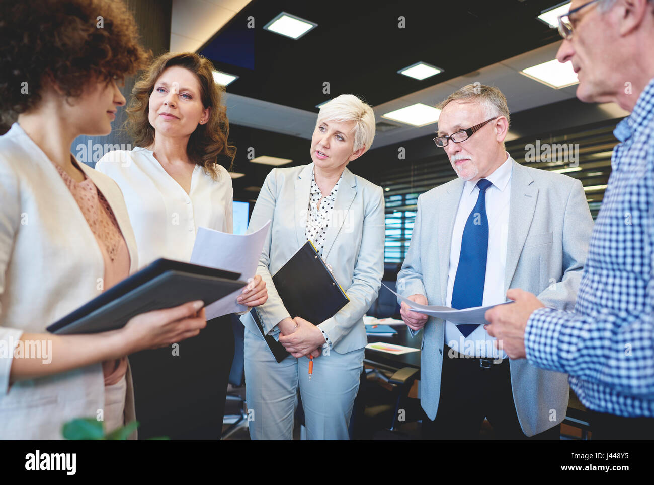 Business woman suggesting different option Stock Photo - Alamy
