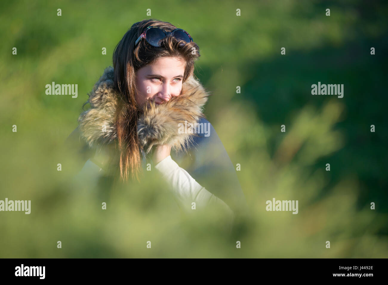 Beautiful and happy young girl posing outdoors Stock Photo - Alamy
