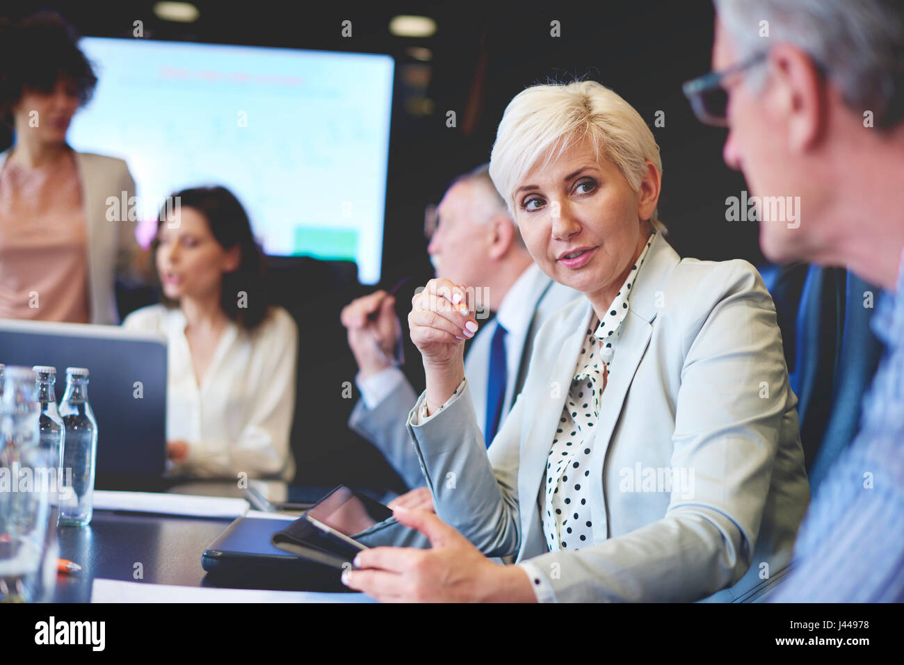 Business woman sharing concept with work mate Stock Photo - Alamy