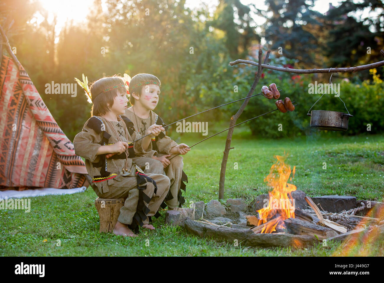 Cute portrait of native american boys with costumes, playing outdoor ...
