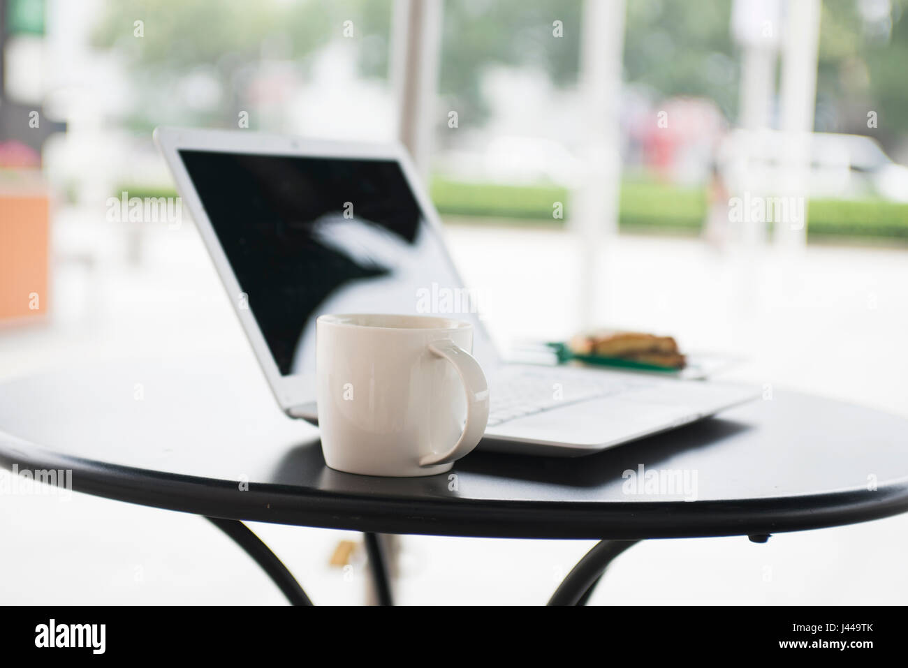 street cafe.A close-up of coffee cup and laptop computers Stock Photo ...