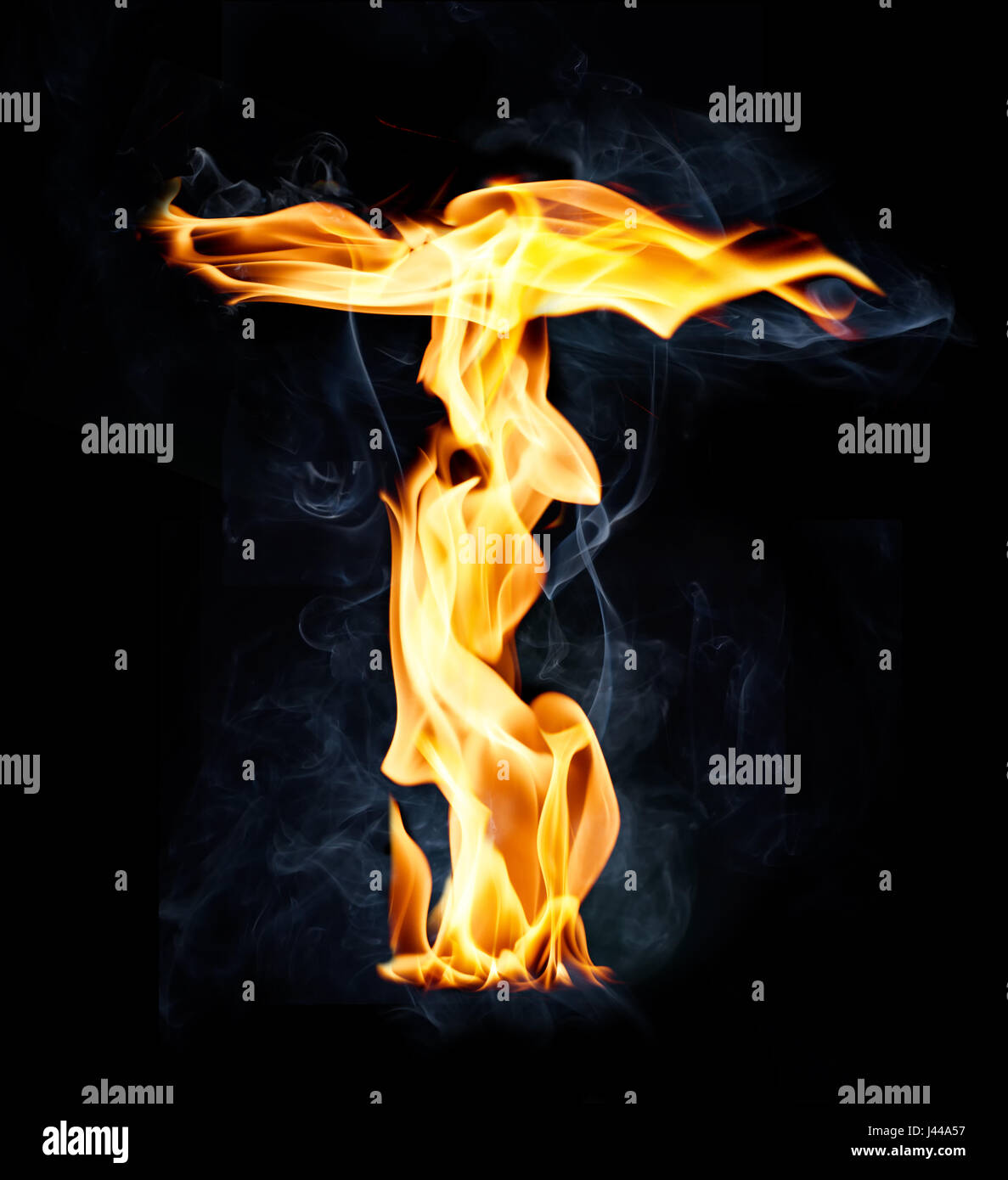 Letter T. Fire and smoke alphabet over black background Stock Photo - Alamy