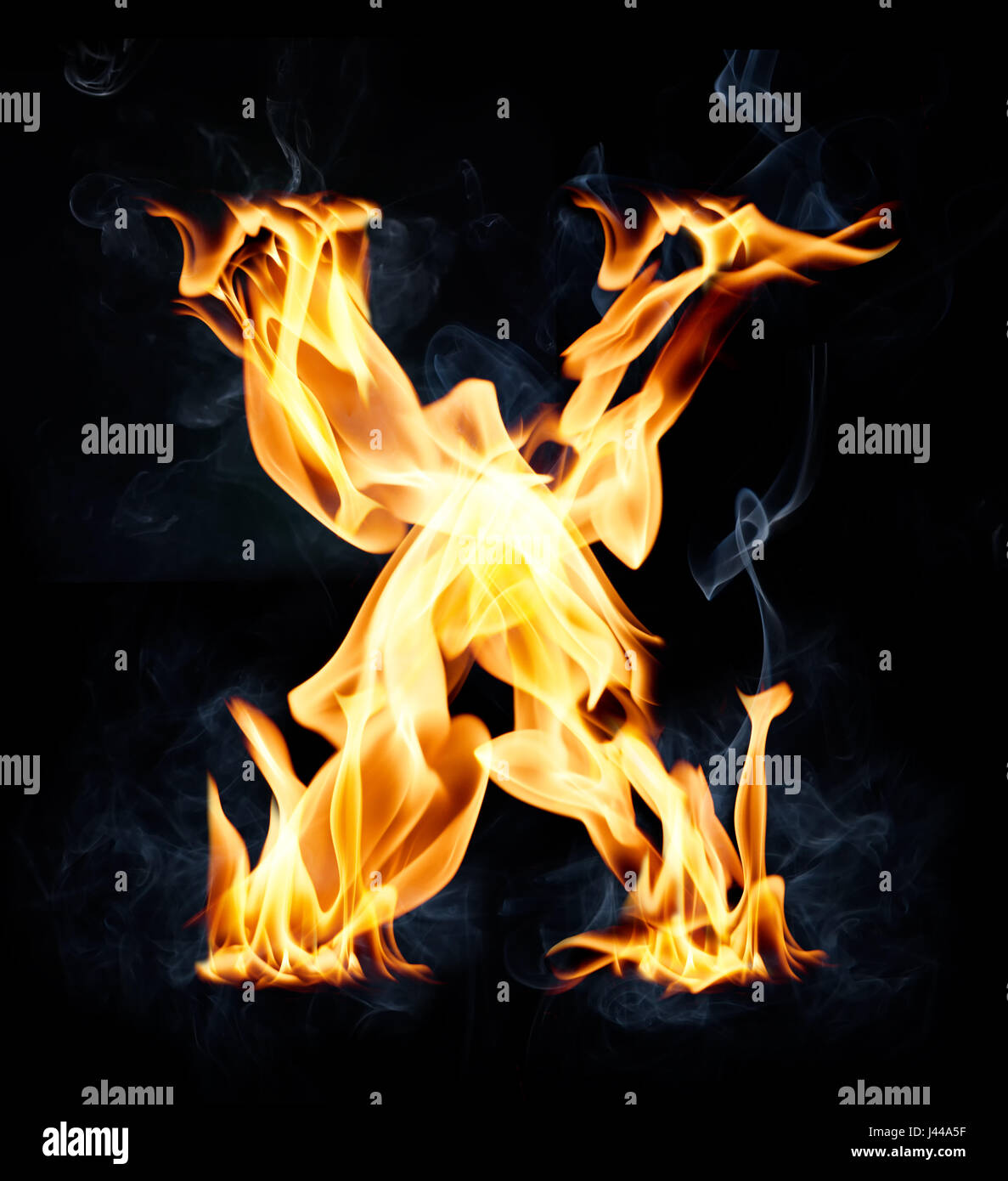 Letter X. Fire and smoke alphabet over black background Stock Photo - Alamy