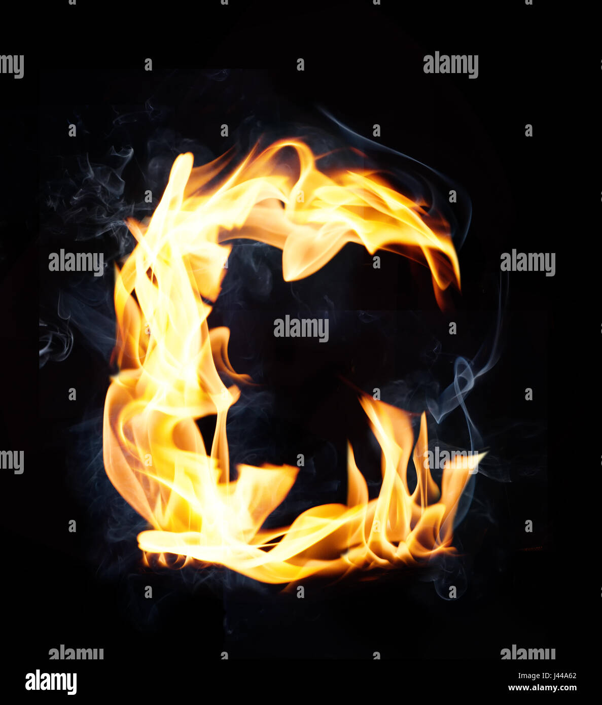 Letter C. Fire and smoke alphabet over black background Stock Photo - Alamy