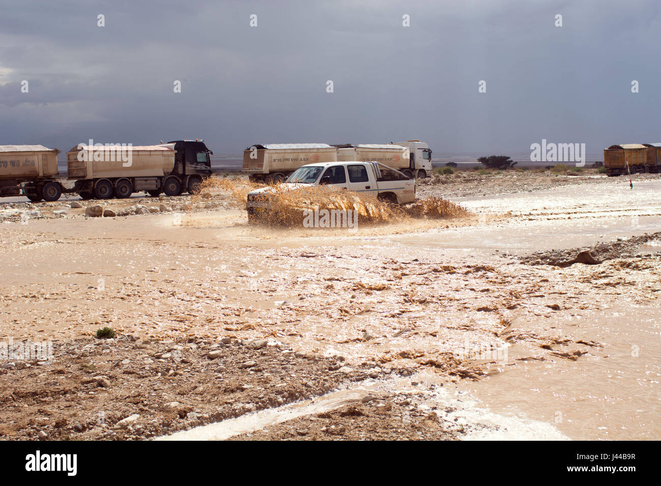 Roadwork, hard working conditions on the road, cars trying to pass ...