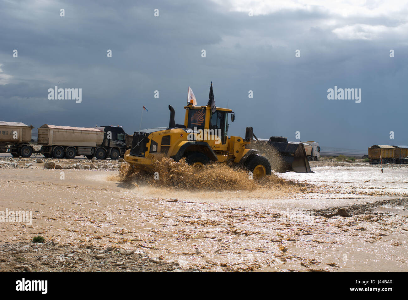 Roadwork, hard working conditions on the road, cars trying to pass ...