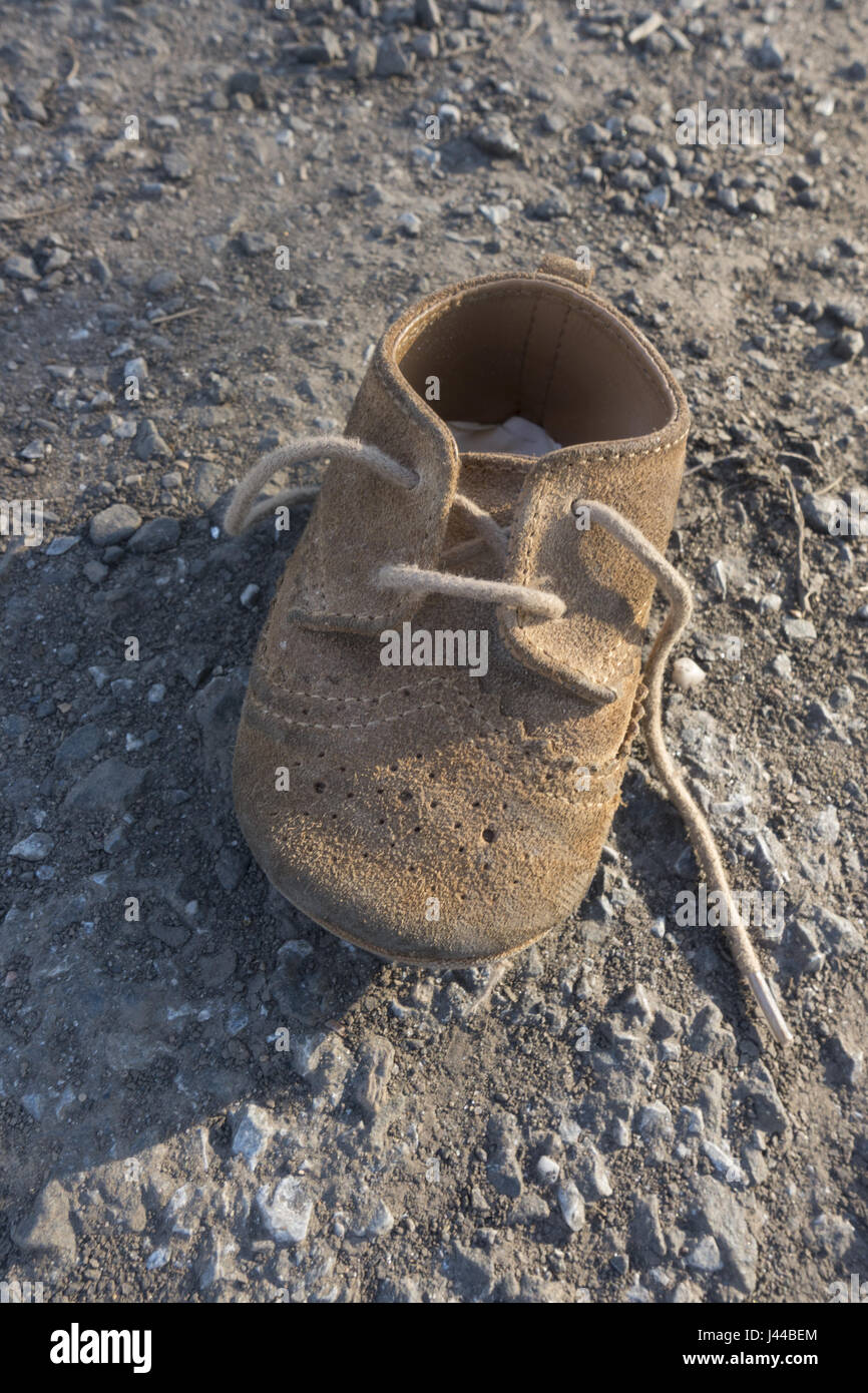Baby shoe lost in Prospect Park, Brooklyn, NY Stock Photo - Alamy