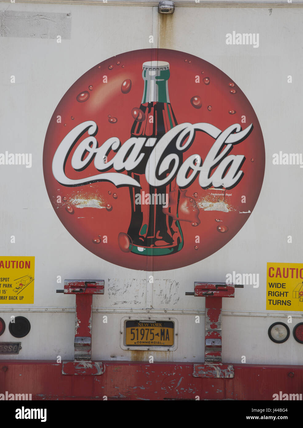 Classic Coca-Cola icon on the back of a delivery truck on the street in ...
