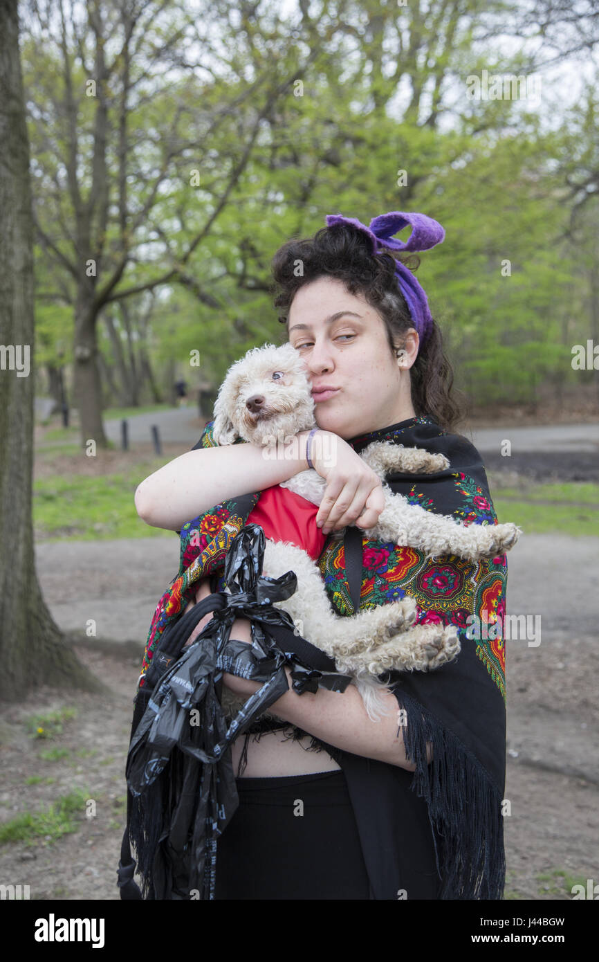 Young woman gives a little kiss to her pooch in Prospect Park, Brooklyn ...