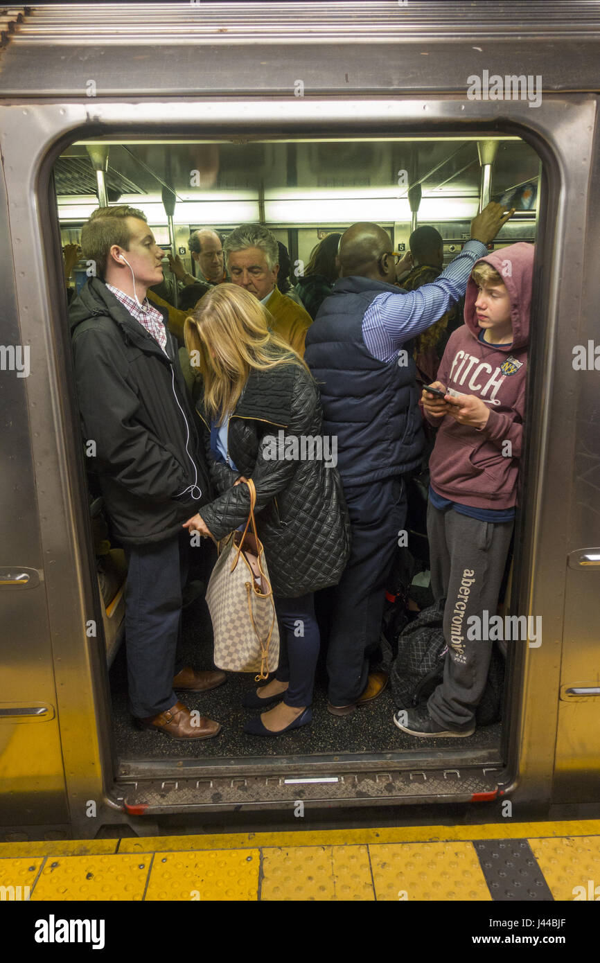 Evening rush hour at the 42nd Street subway station below Grand Central ...