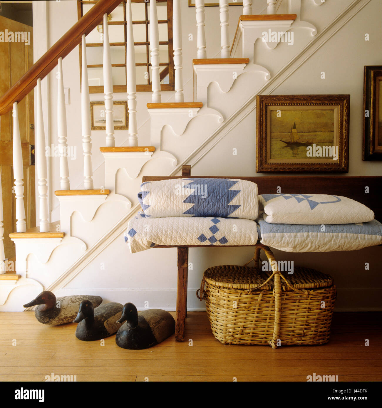 Blankets on bench by staircase Stock Photo - Alamy