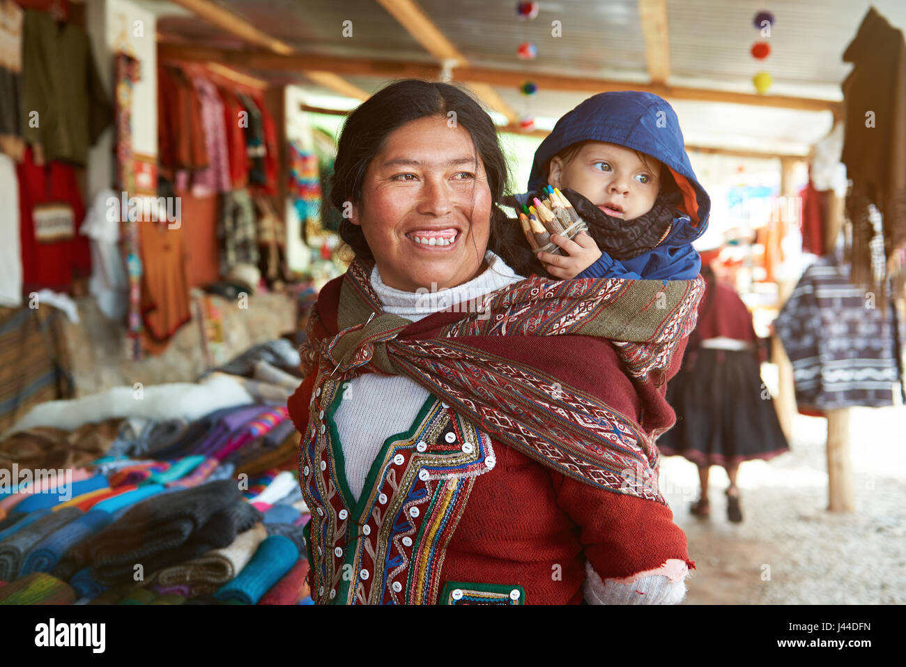 Cusco, Peru - April 21, 2017: Peruvian woman have fun with kid. Woman ...