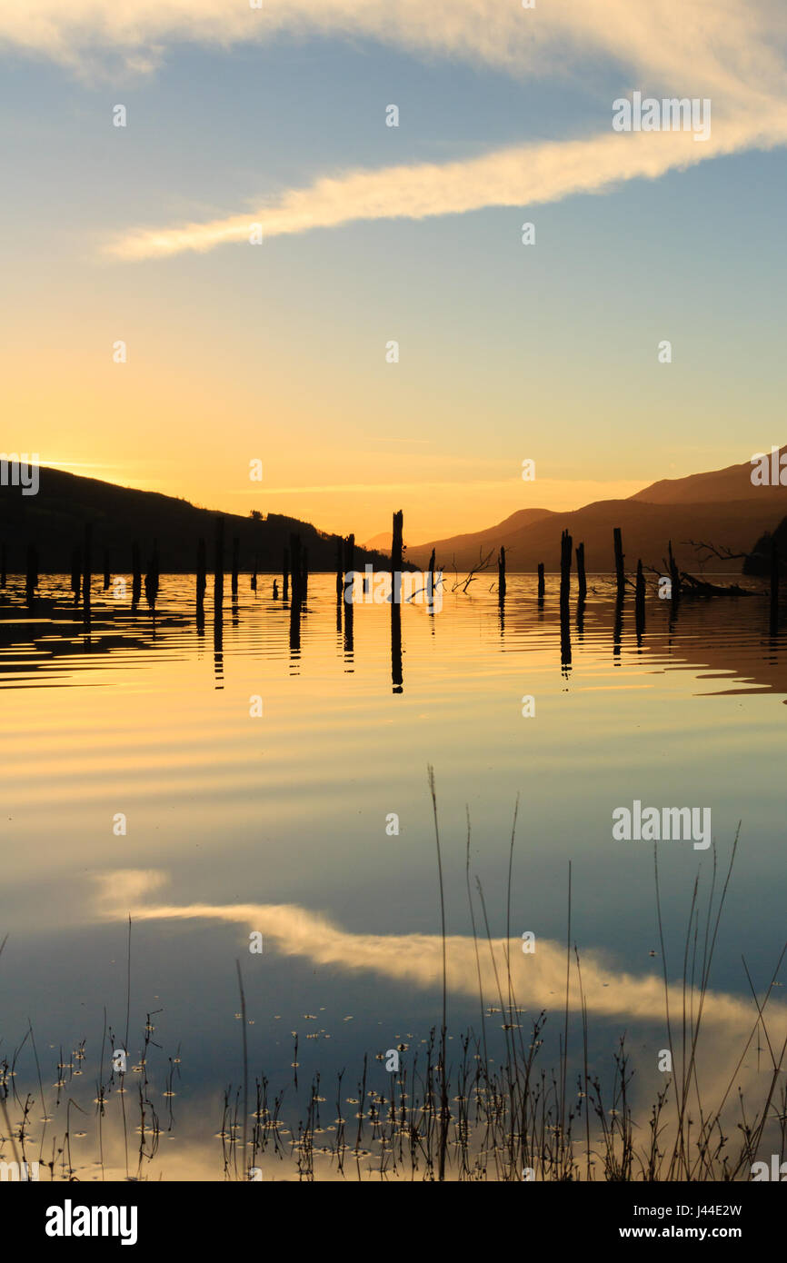 A ruined jetty reflects on Loch Tay at sunset Stock Photo - Alamy