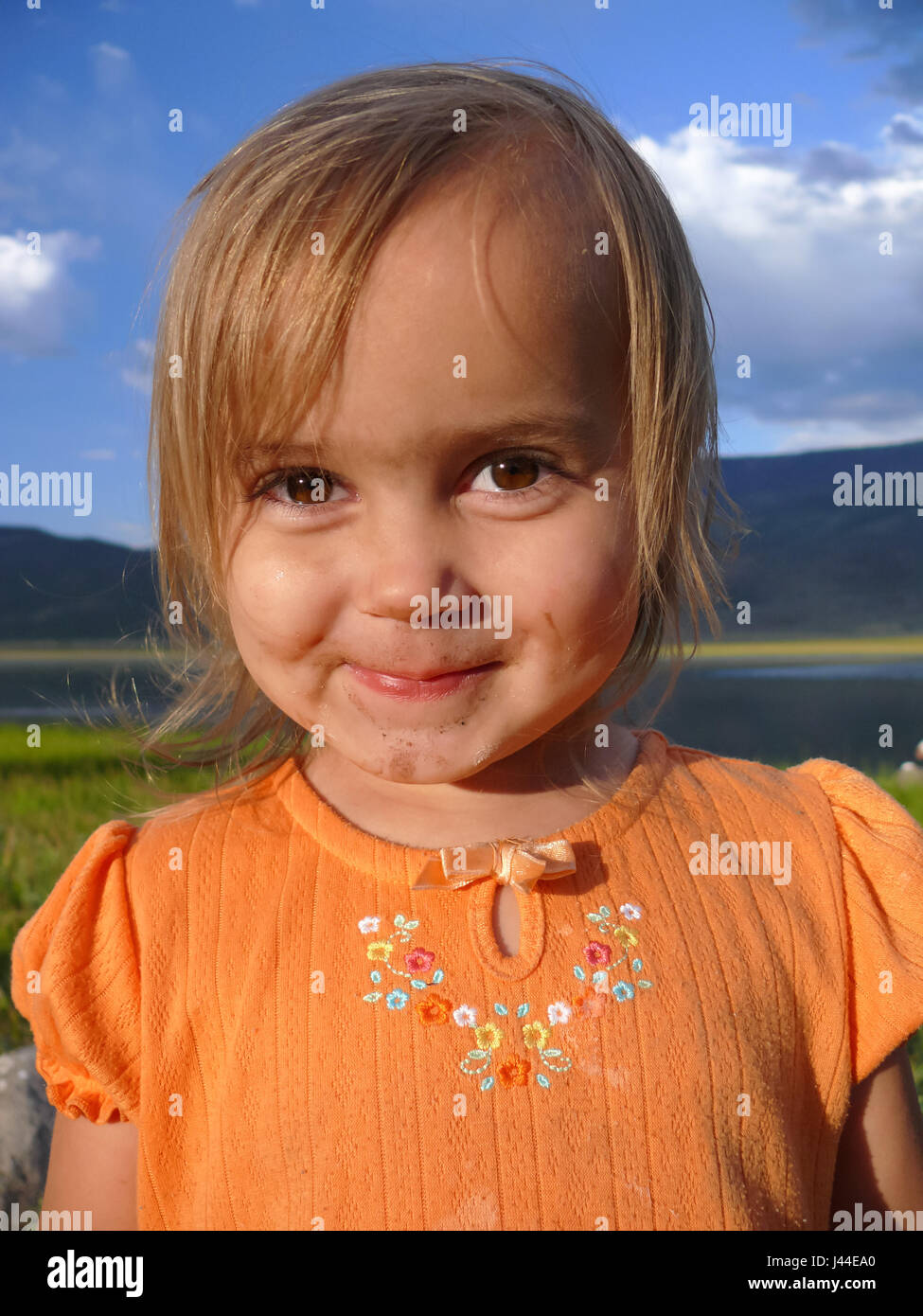 Smiling girl with a messy face Stock Photo - Alamy