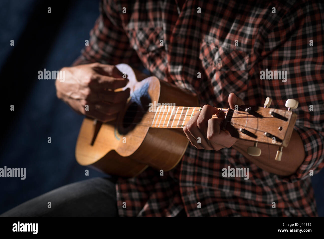 Four string instrument Stock Photo - Alamy