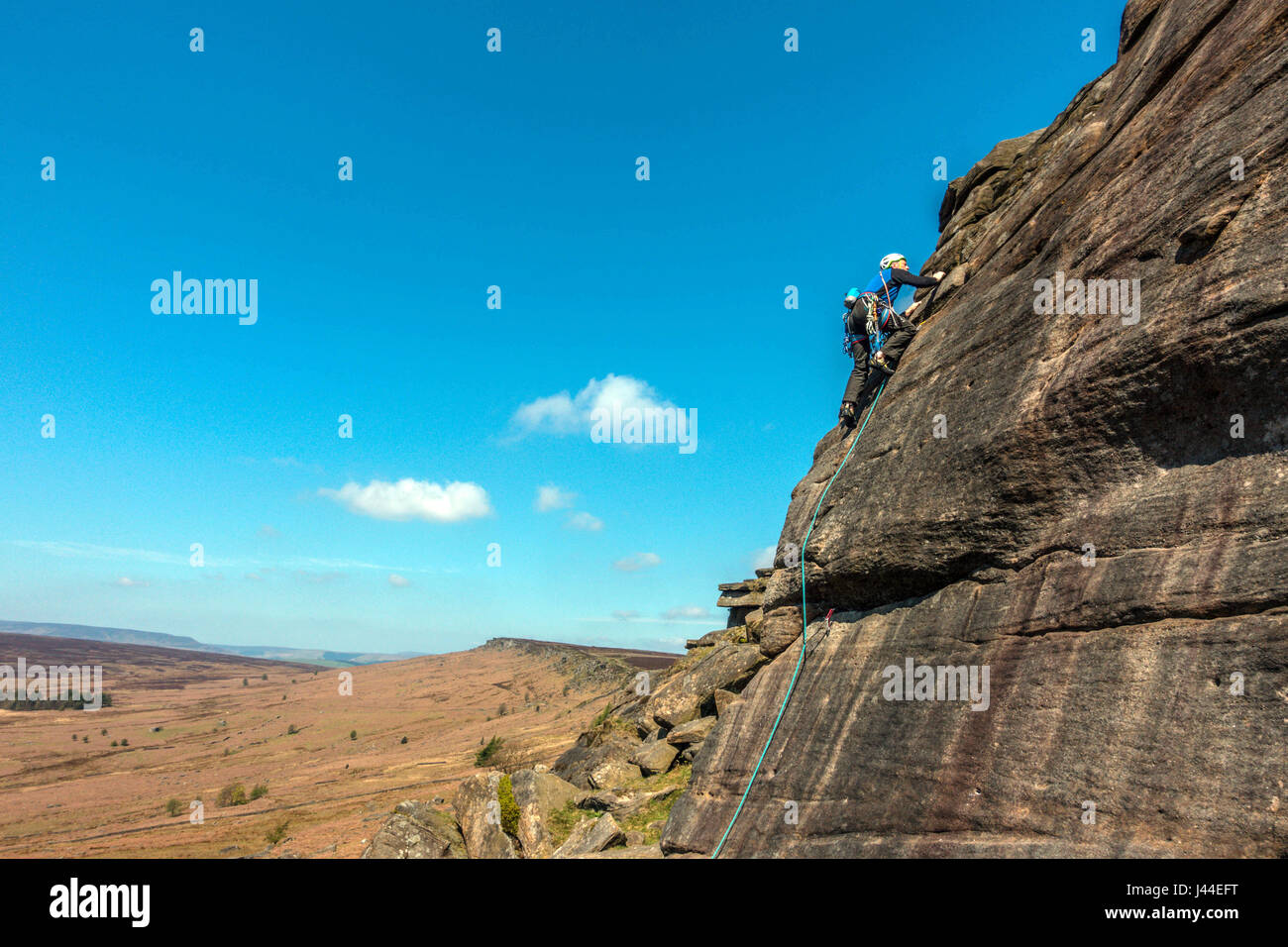 Rock climbers on Stanage Edge, Peak District, Derbyshire Stock Photo ...