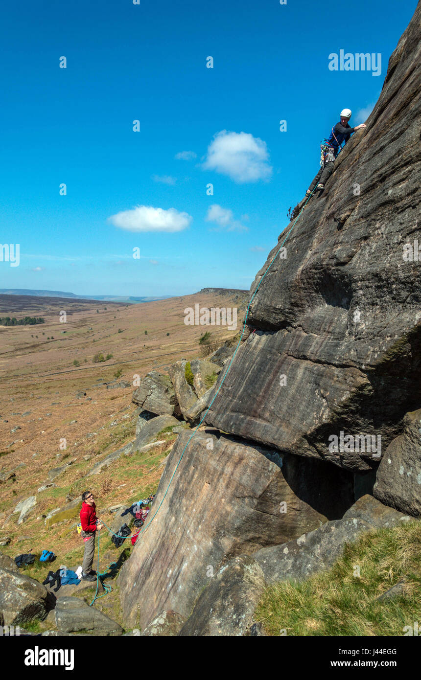 Rock climbers on Stanage Edge, Peak District, Derbyshire Stock Photo ...