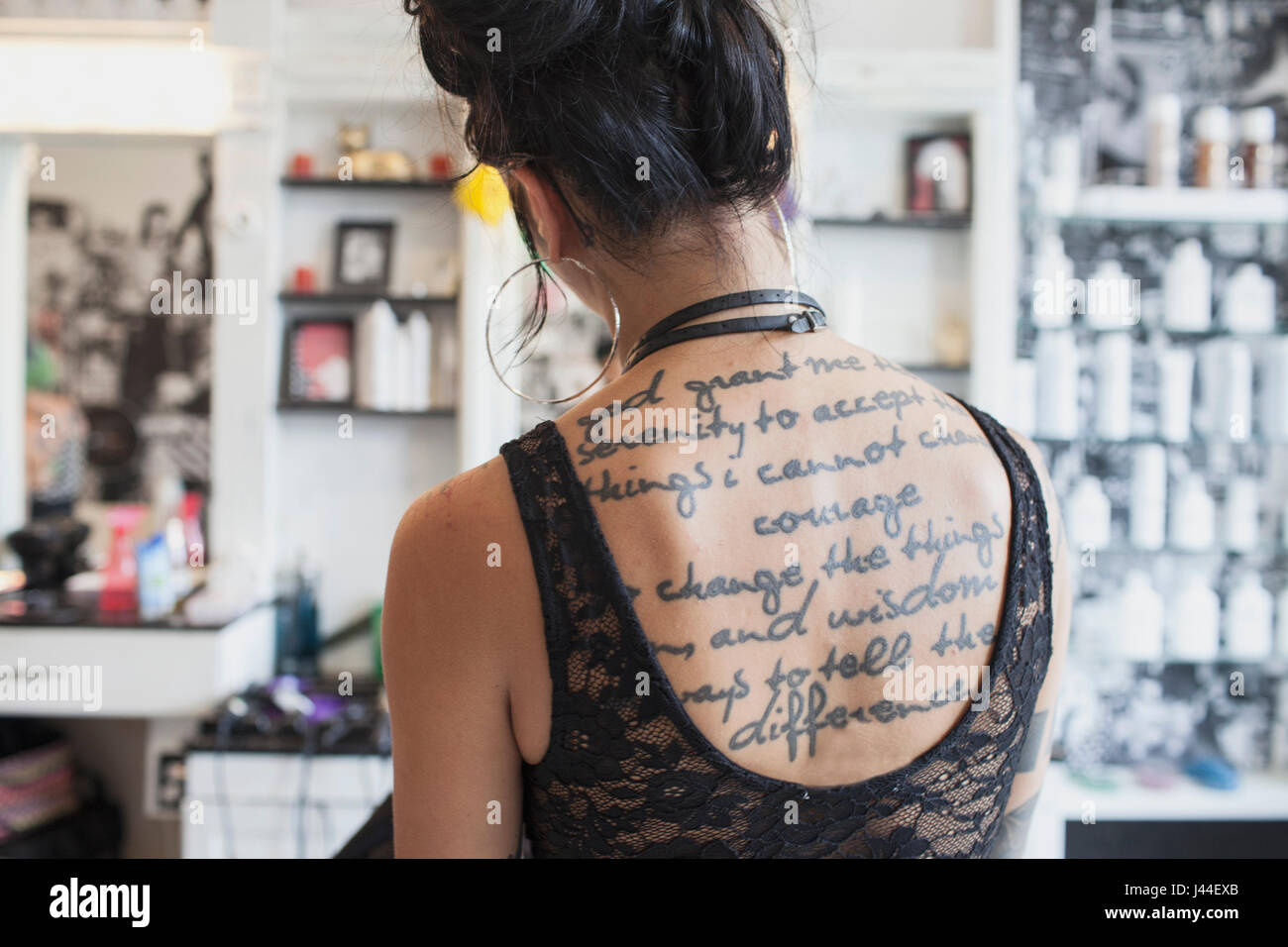 The tattooed back of a woman Stock Photo - Alamy