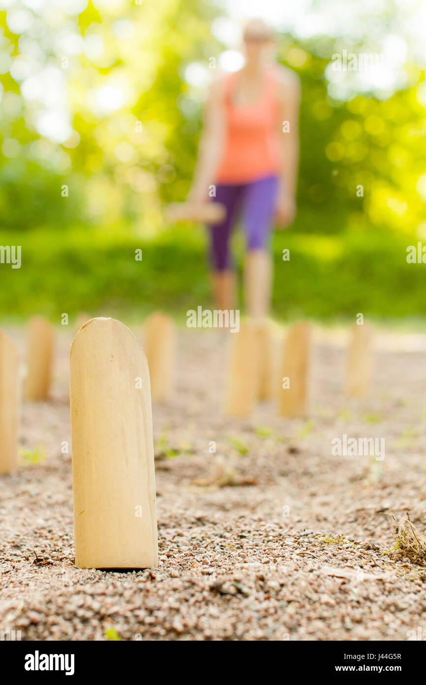 Female Throwing Wooden Bricks in Outdoors Recreational Game Called ...