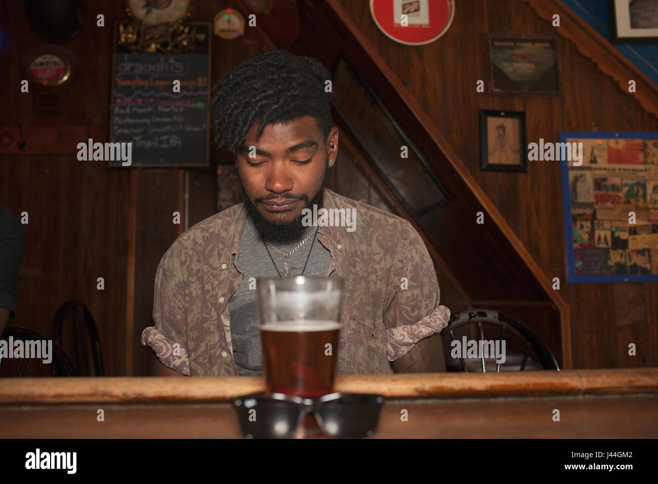 A young man at a bar Stock Photo - Alamy