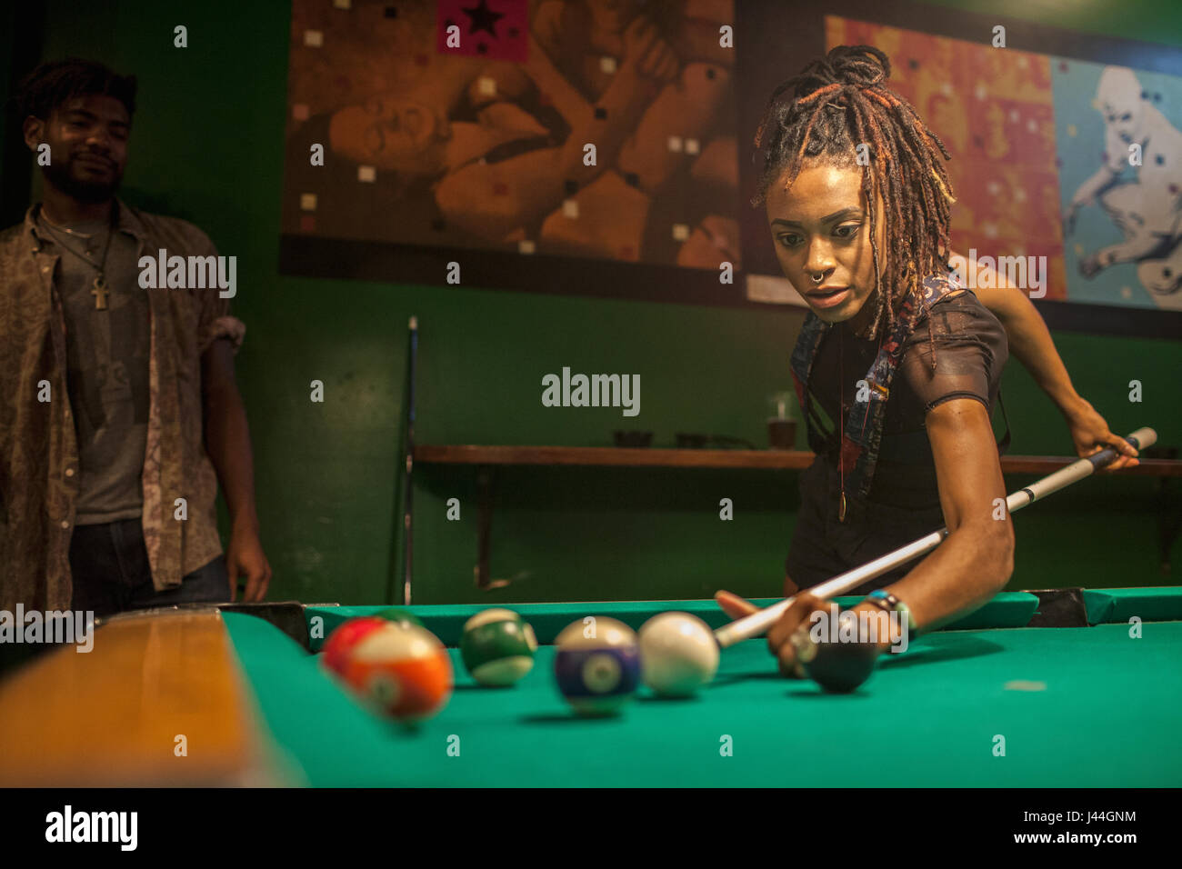 African american woman playing pool hi-res stock photography and images ...