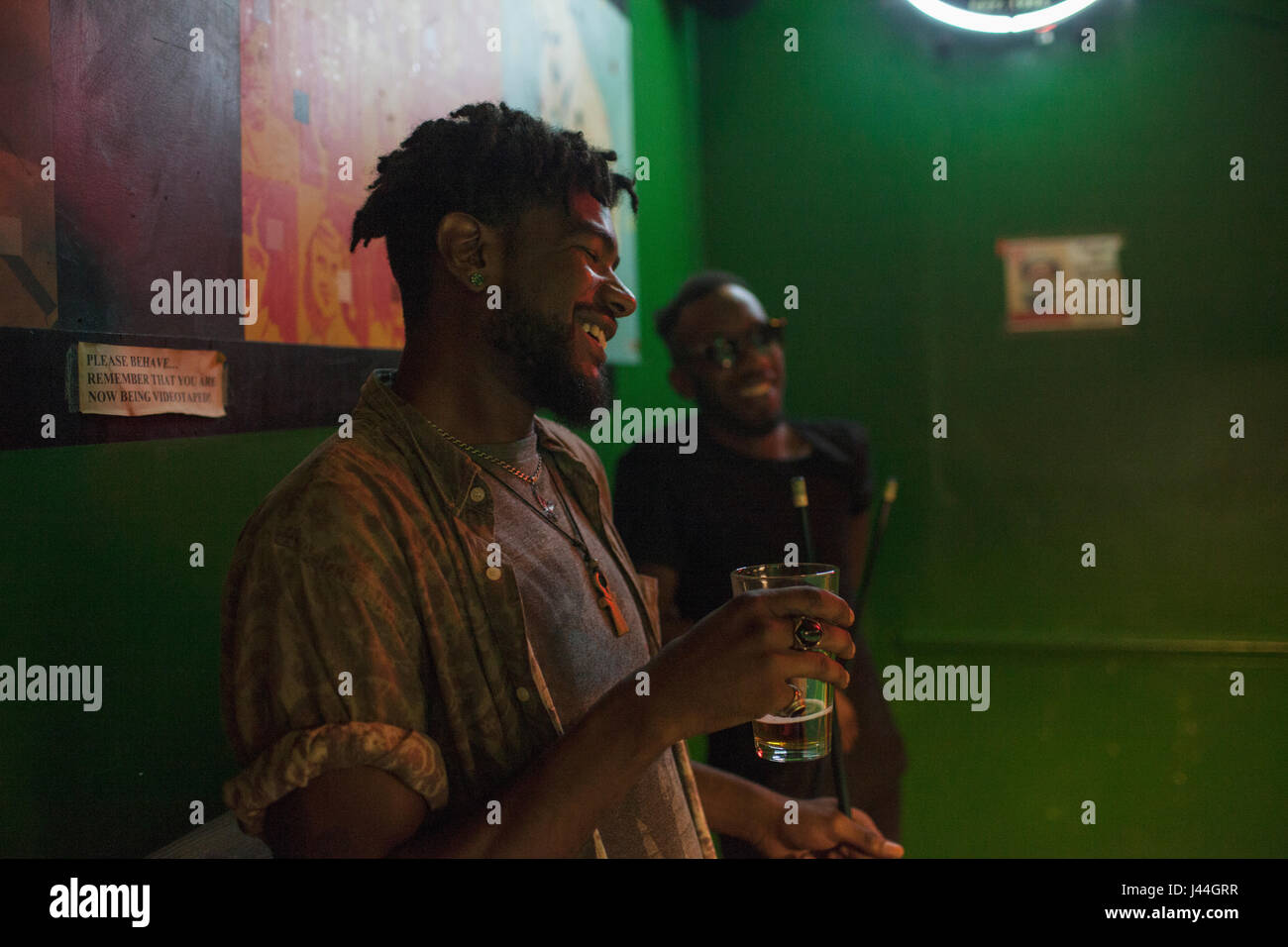 Two young men at a bar Stock Photo - Alamy