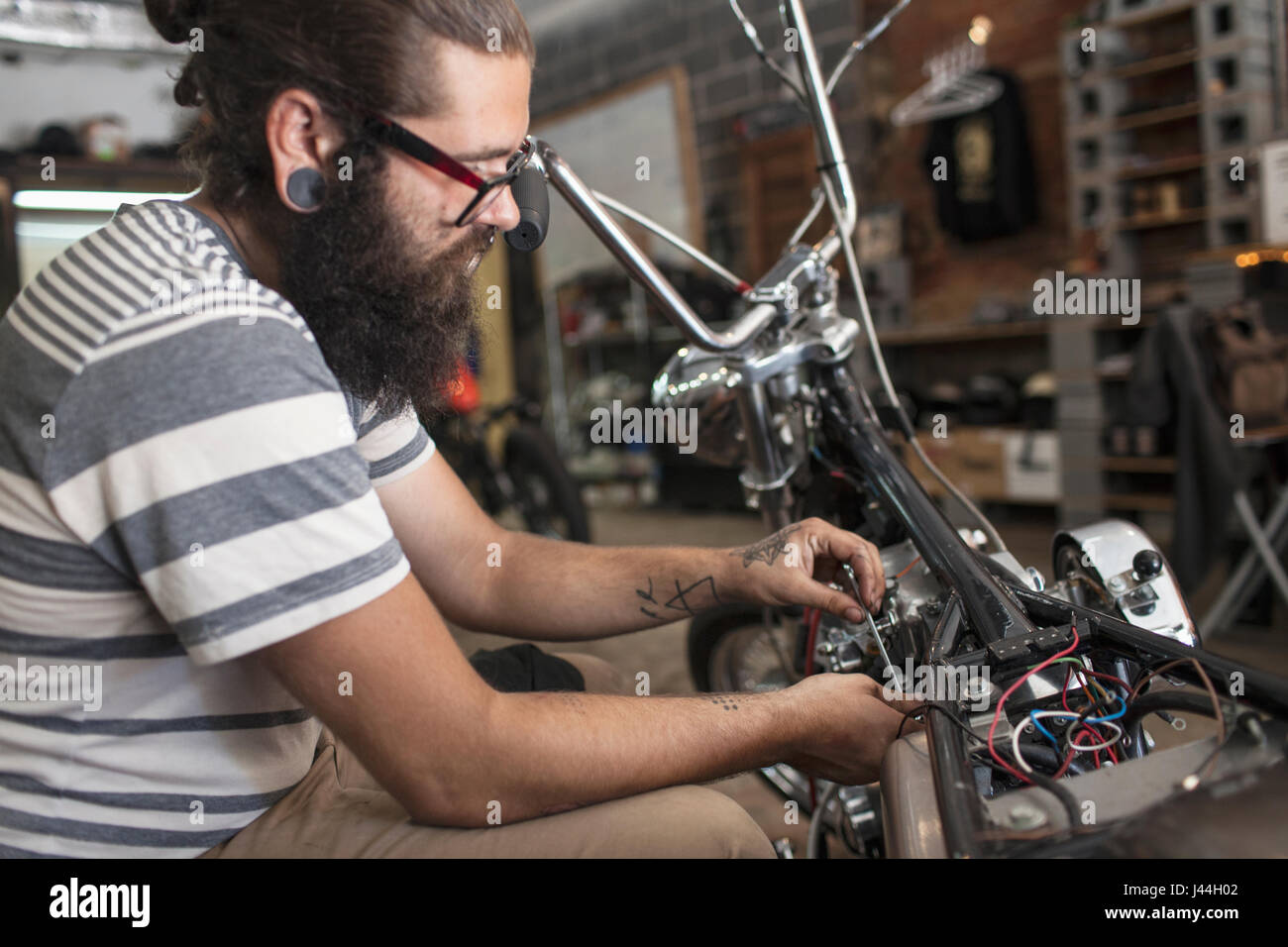 Man repairing a motorcycle hi-res stock photography and images - Alamy