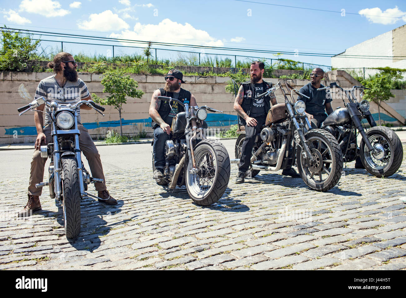 A group of young men on motorcycles Stock Photo - Alamy