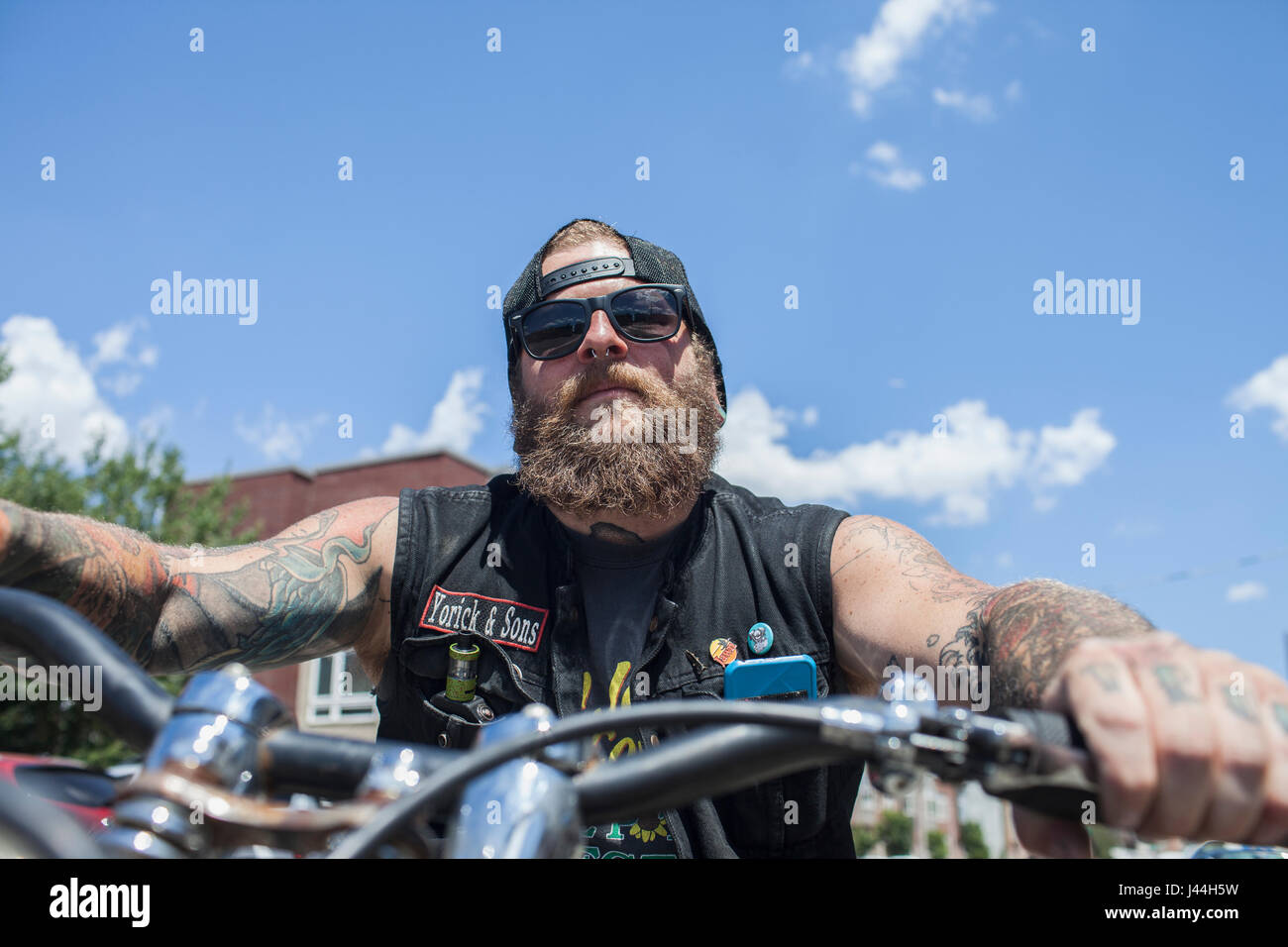 A young man riding a motorcycle Stock Photo - Alamy