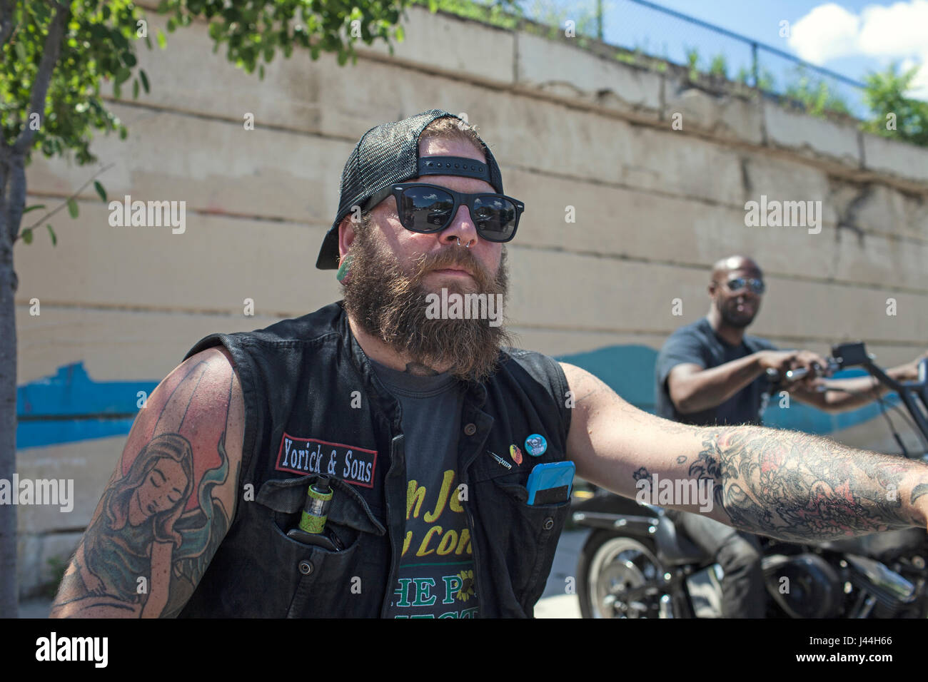 Two young men riding a motorcycle Stock Photo - Alamy