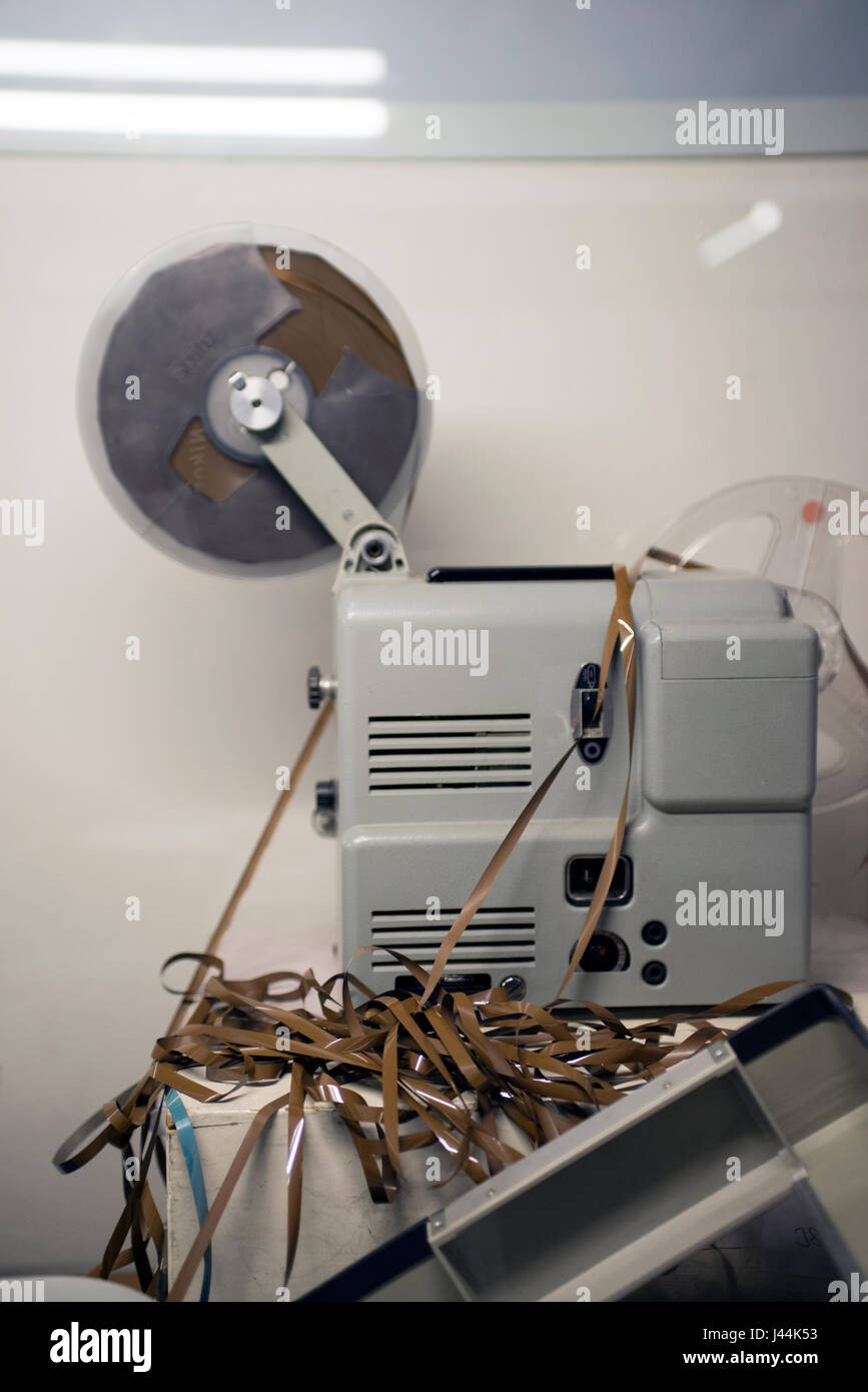 Tape recorder and messed up tapes on a white background Stock Photo - Alamy