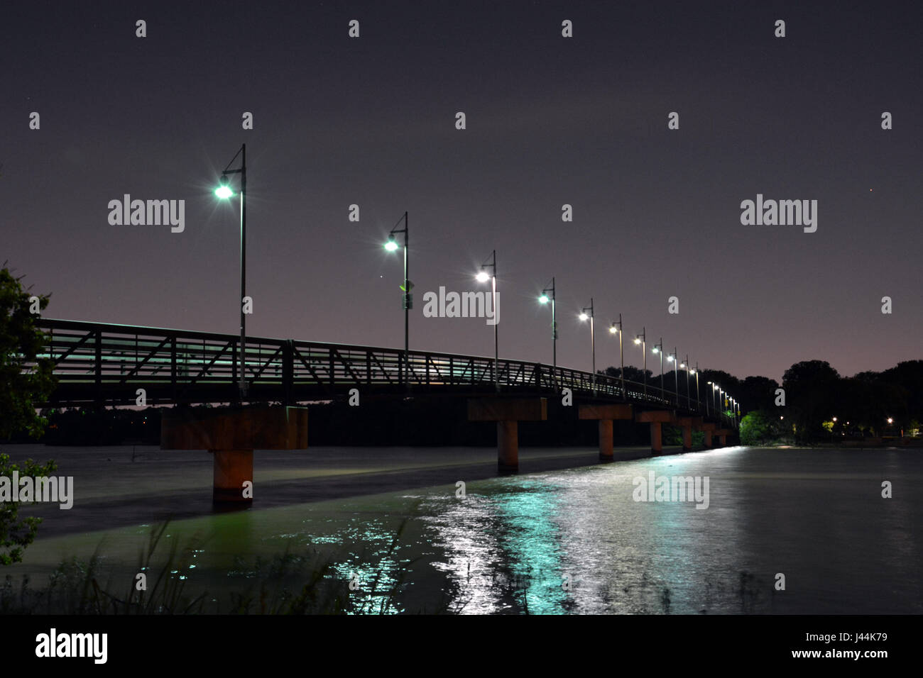 Lights illuminate the Mockingbird footbridge at night at the northern ...